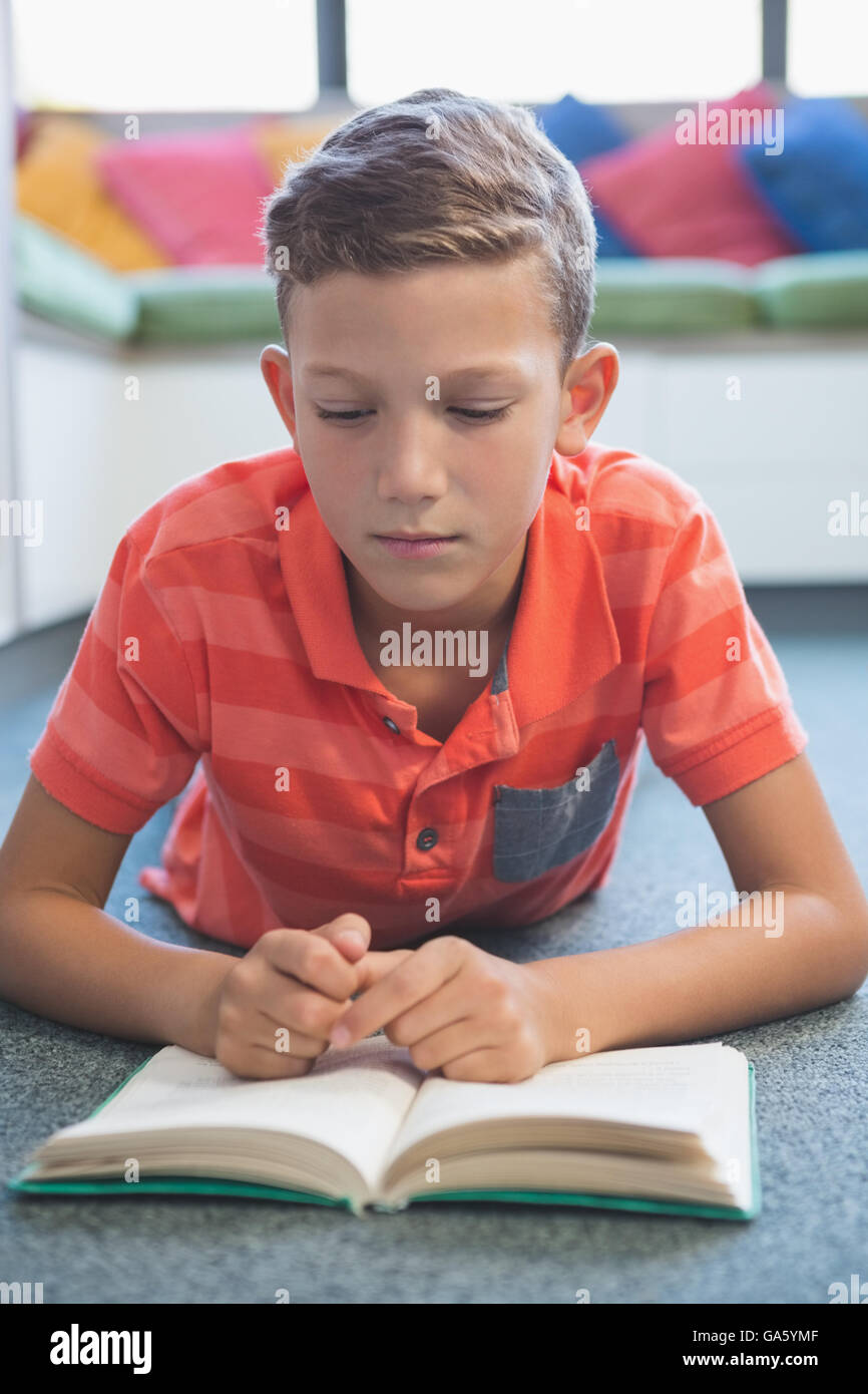 Boy lying on floor book hi-res stock photography and images - Alamy
