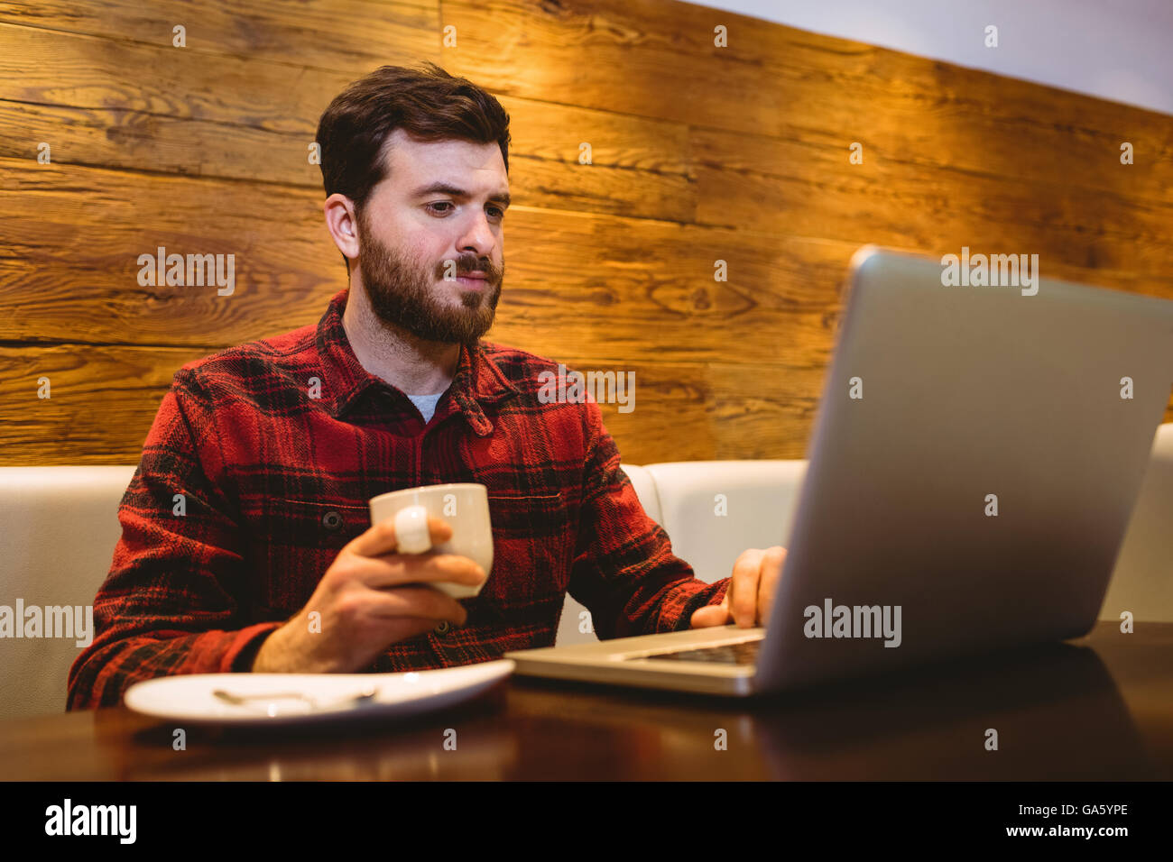 Caucasian young man using hi-res stock photography and images - Alamy