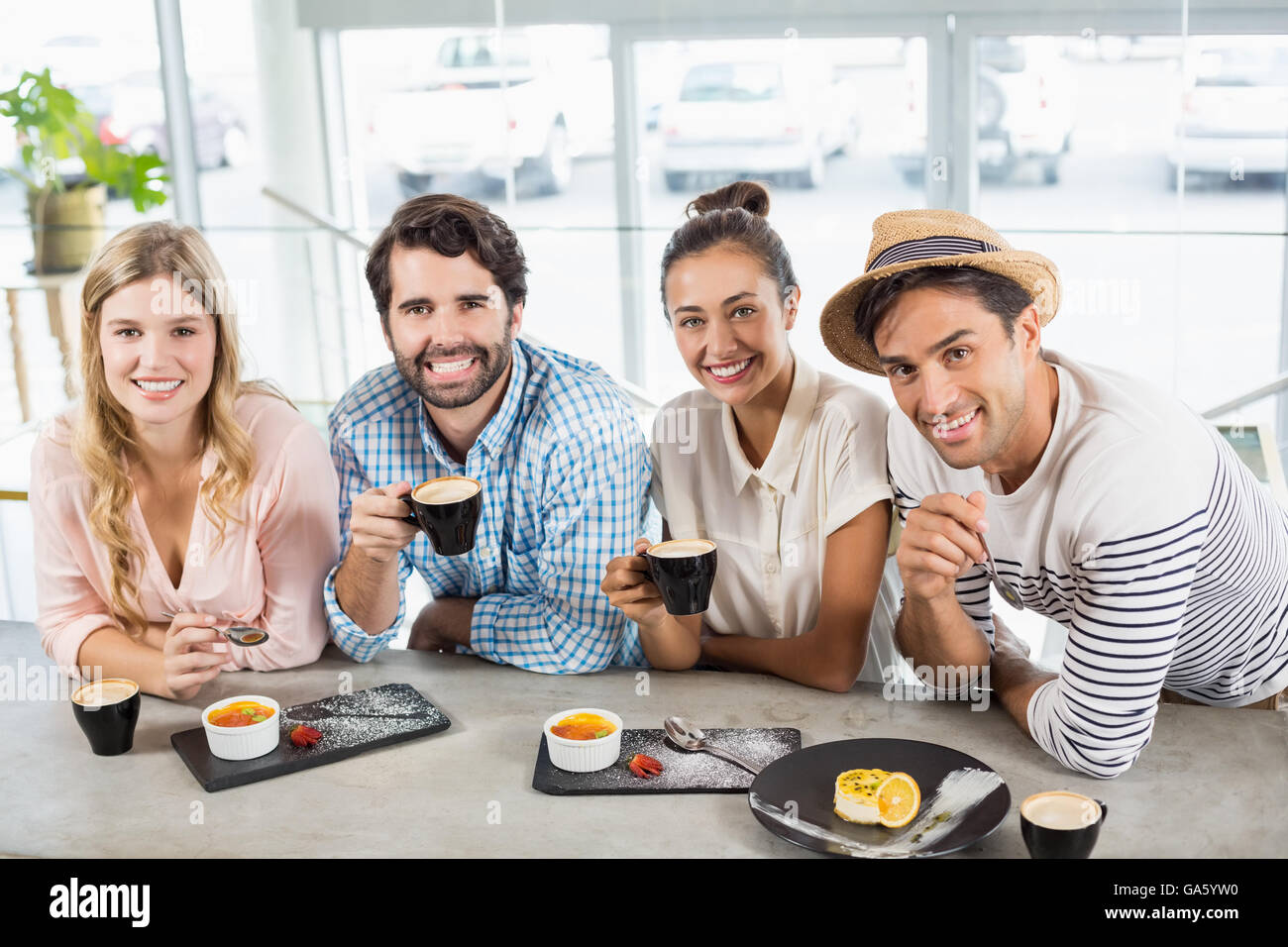 Smiling friends having cup hi-res stock photography and images - Alamy