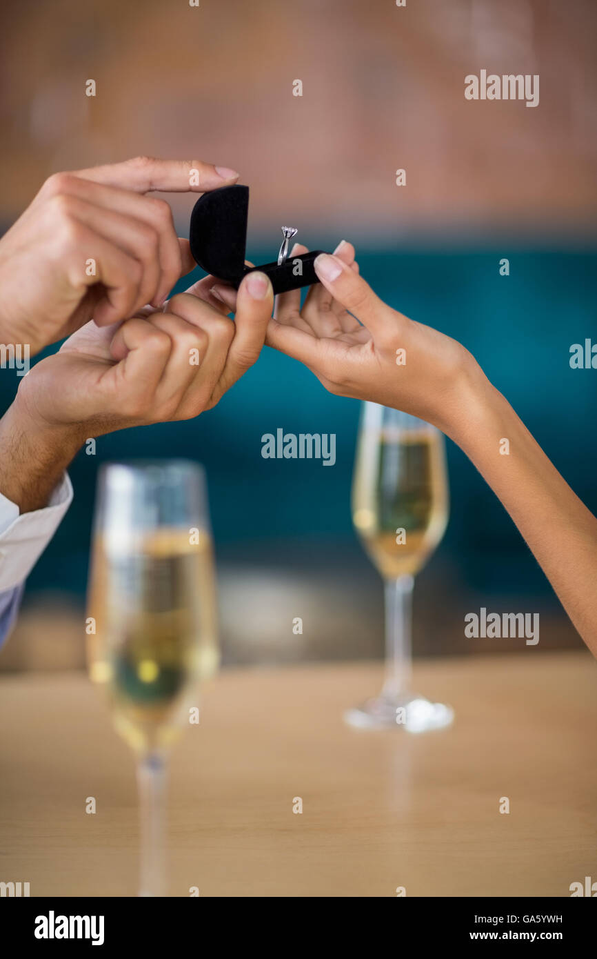 Man proposing to woman offering engagement ring Stock Photo - Alamy