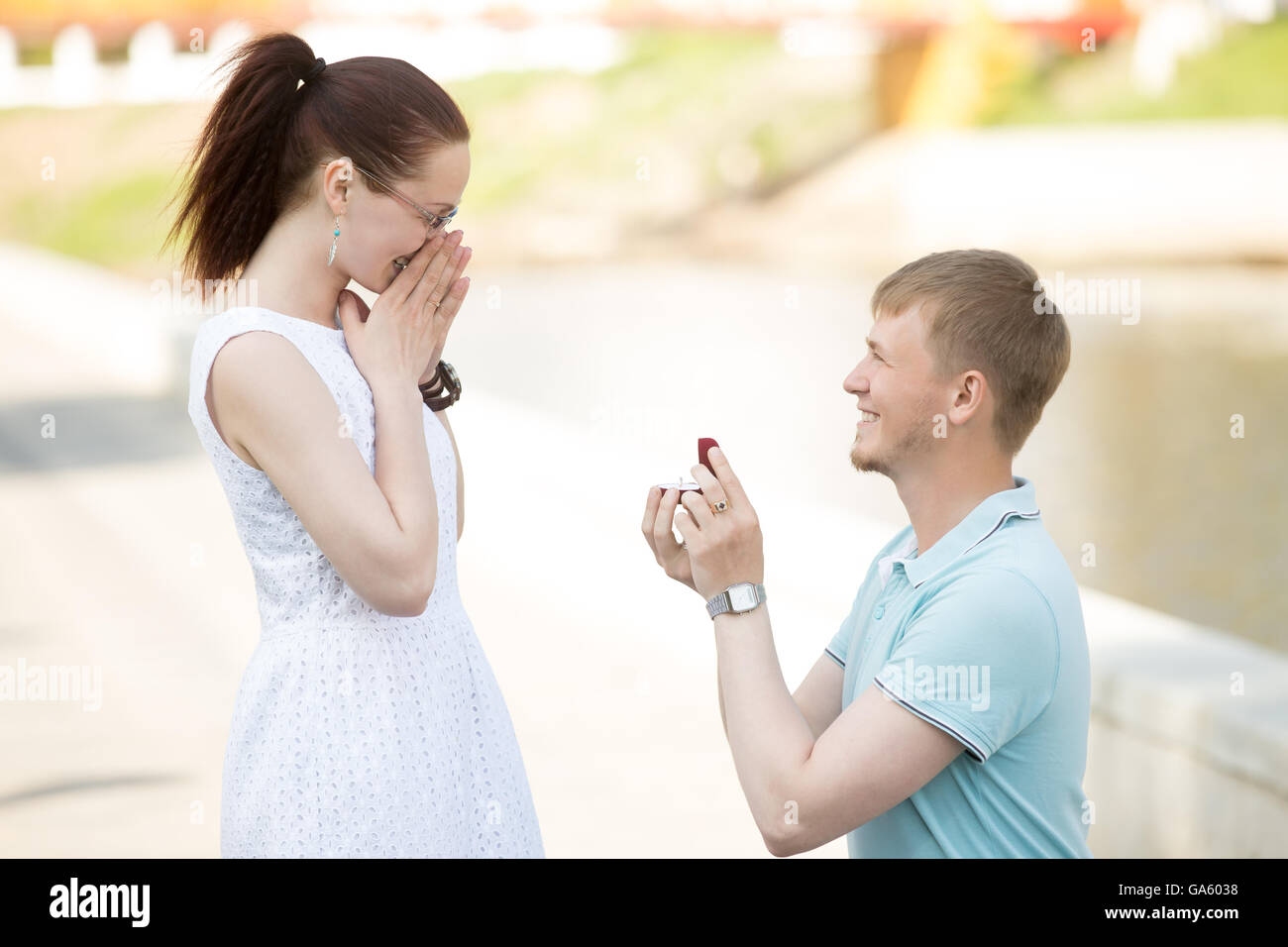 Handsome young man requesting hand of beloved pretty girlfriend, asking ...