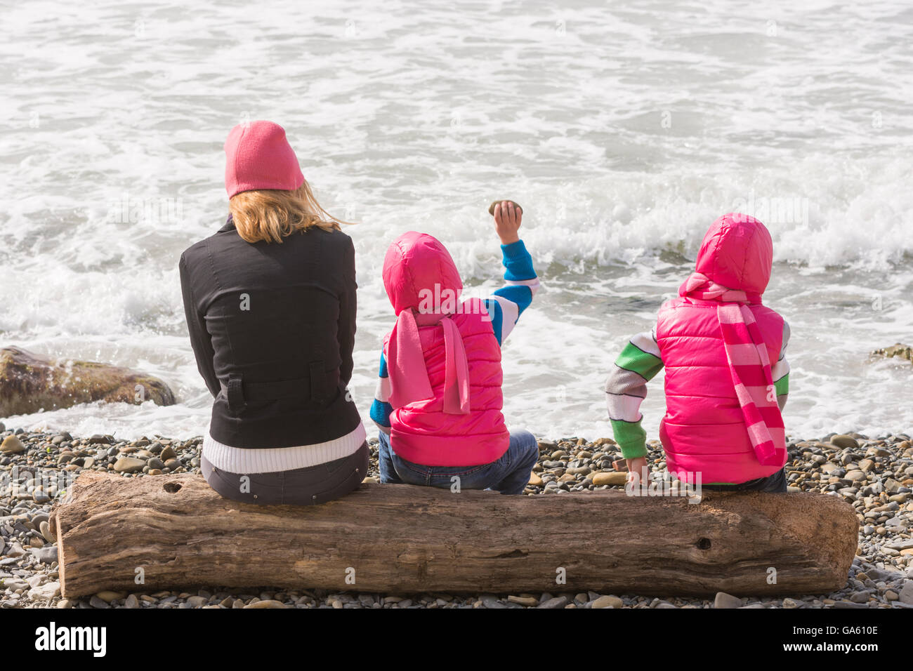 Woman sitting on a log hi-res stock photography and images - Alamy
