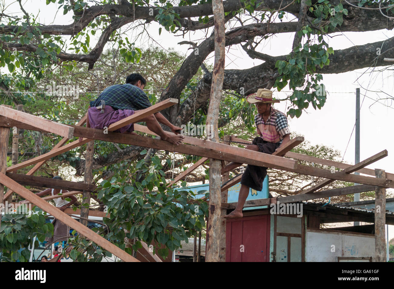 Carpenters working on a house construction site in Myanmar Stock Photo ...