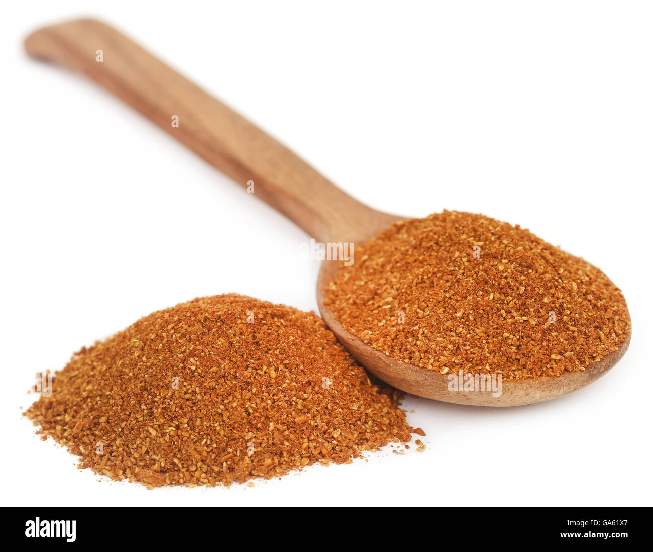 Crushed cumin with whole ones over white background Stock Photo - Alamy