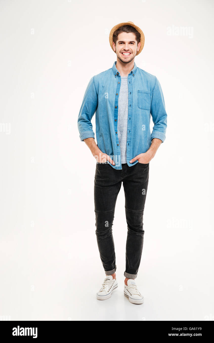 Full length portrait of a happy casual man standing isolated on a white ...