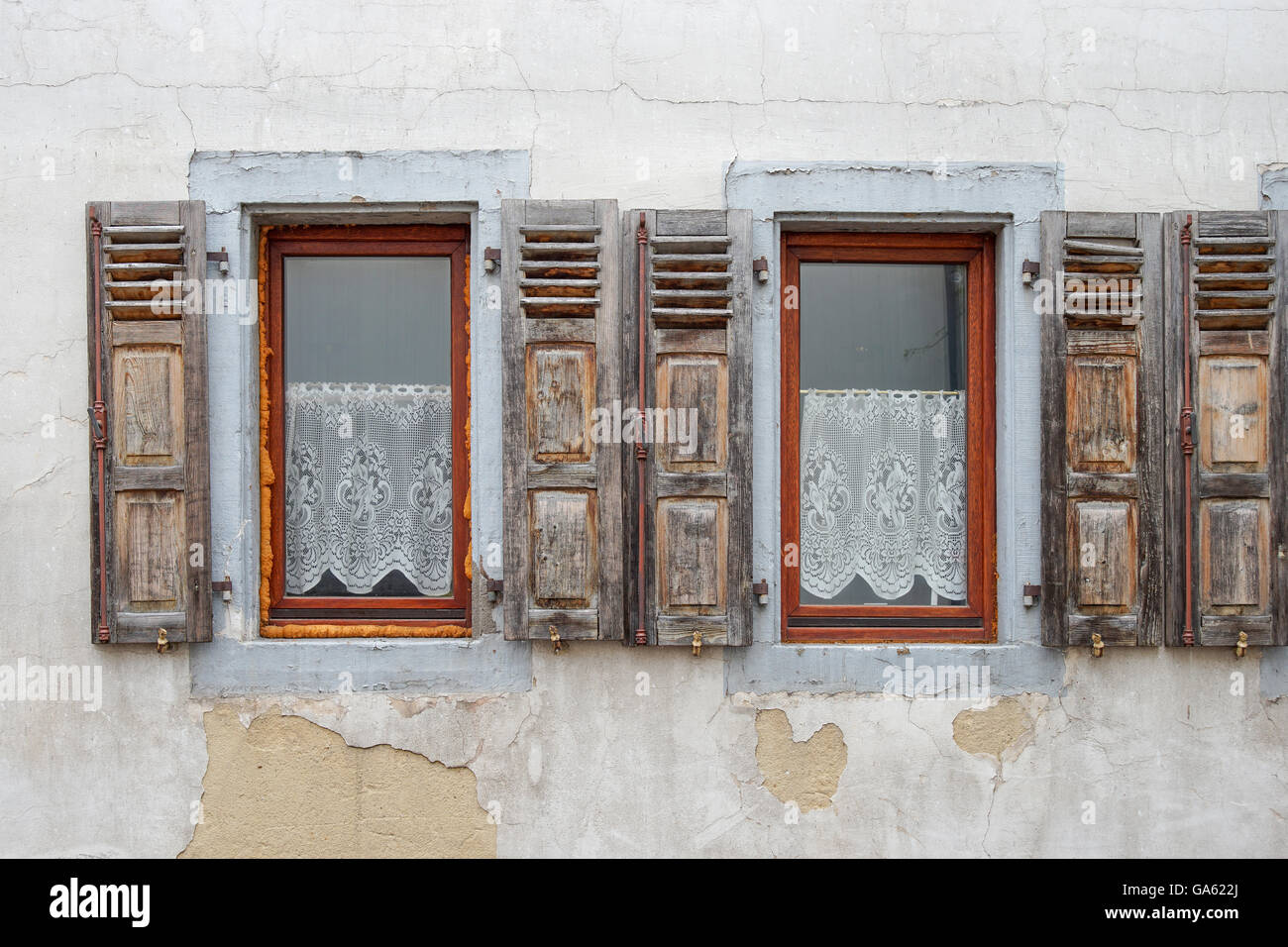 Two old worn window shutter in a row Stock Photo - Alamy