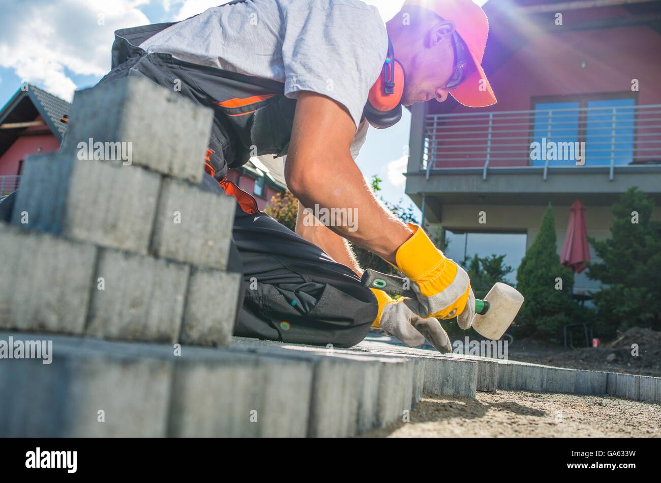Building Brick Garden Path. Caucasian Worker Building Block Paved ...