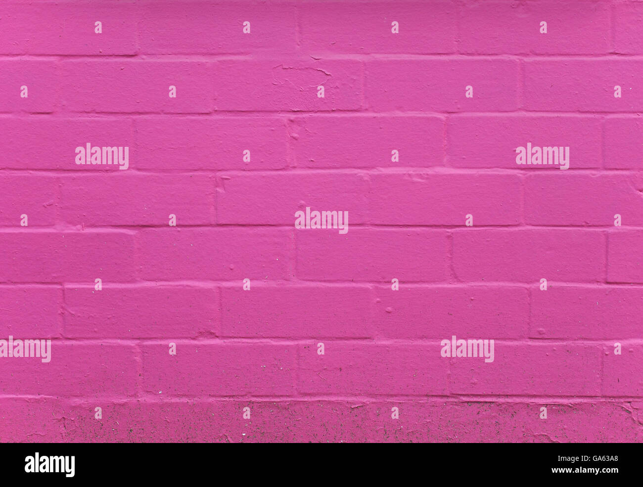 Pink brick wall useful as a background Stock Photo - Alamy