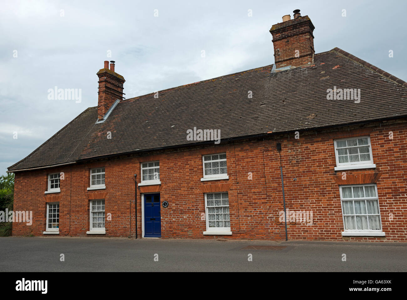 Semi-detached houses with with low front windows, Front Street, Orford ...