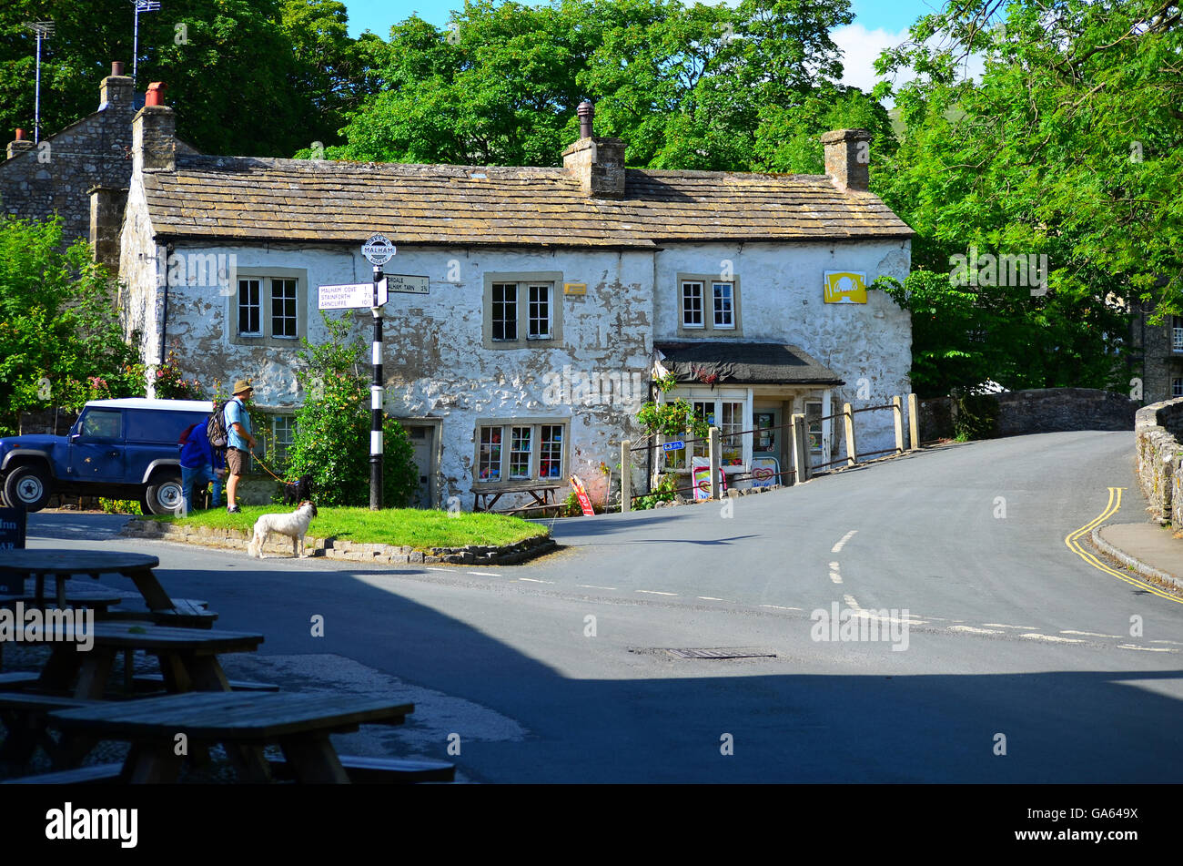Traditional old Road sign and buildings in Malham Cove, Yorkshire Dales ...