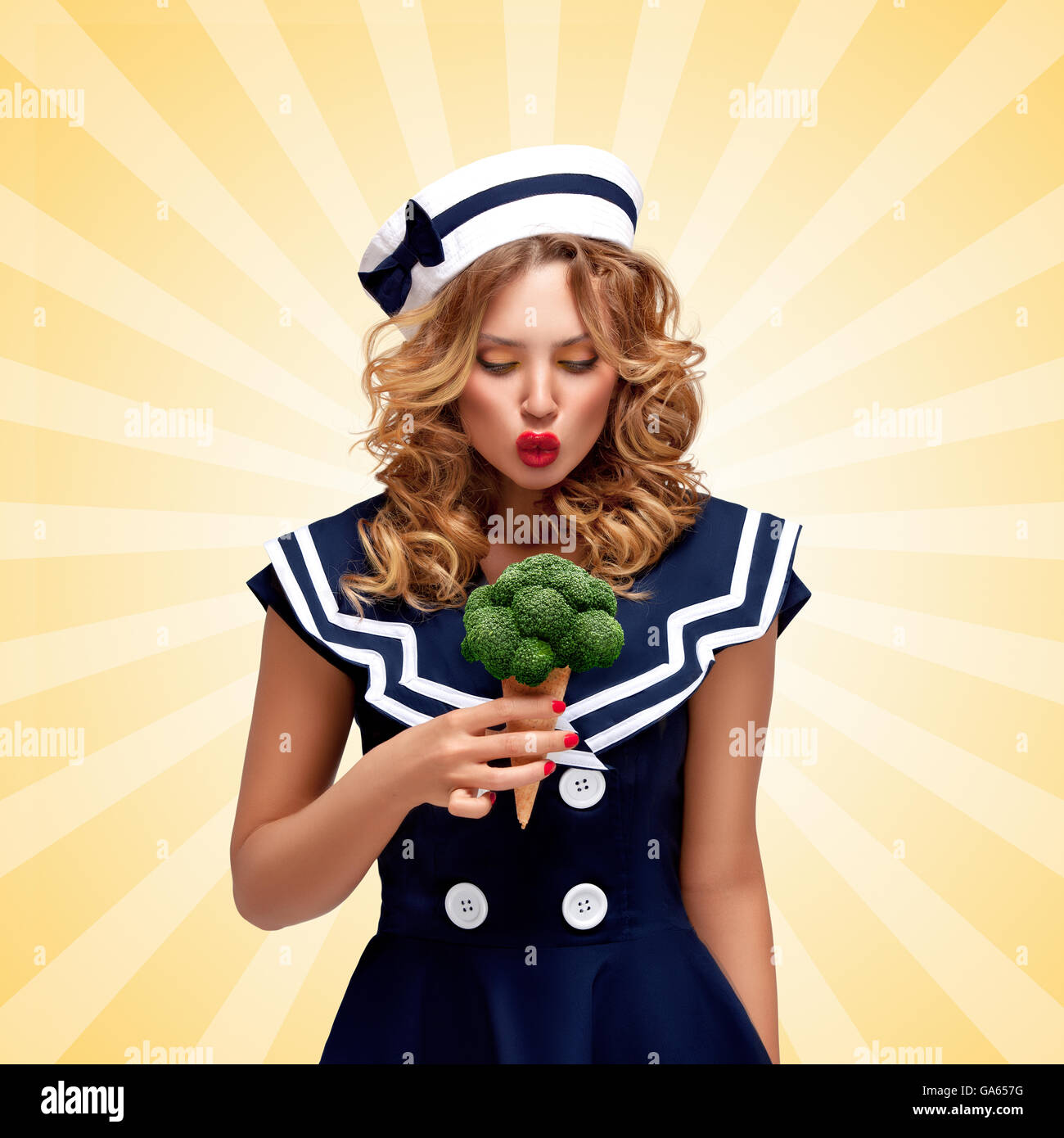 Pin-up sailor girl eating broccoli ice cream on a waffle cone on ...