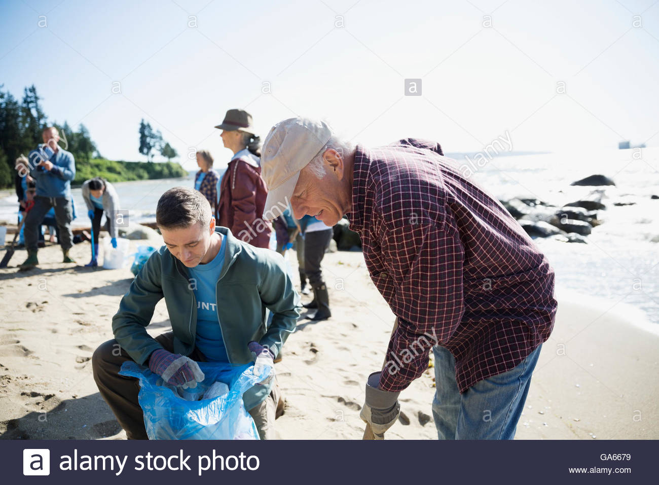 Picking litter beach hi-res stock photography and images - Alamy