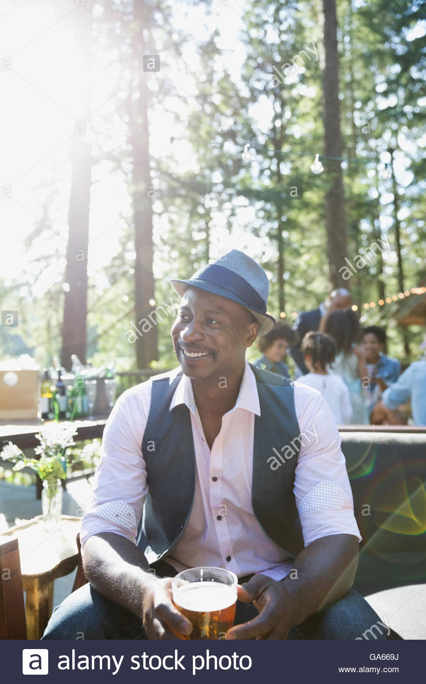 Smiling man drinking beer in hi-res stock photography and images - Alamy