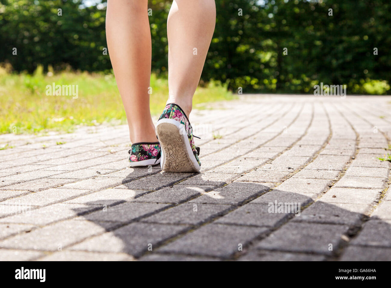 female feet on the sidewalk rear view closeup Stock Photo - Alamy