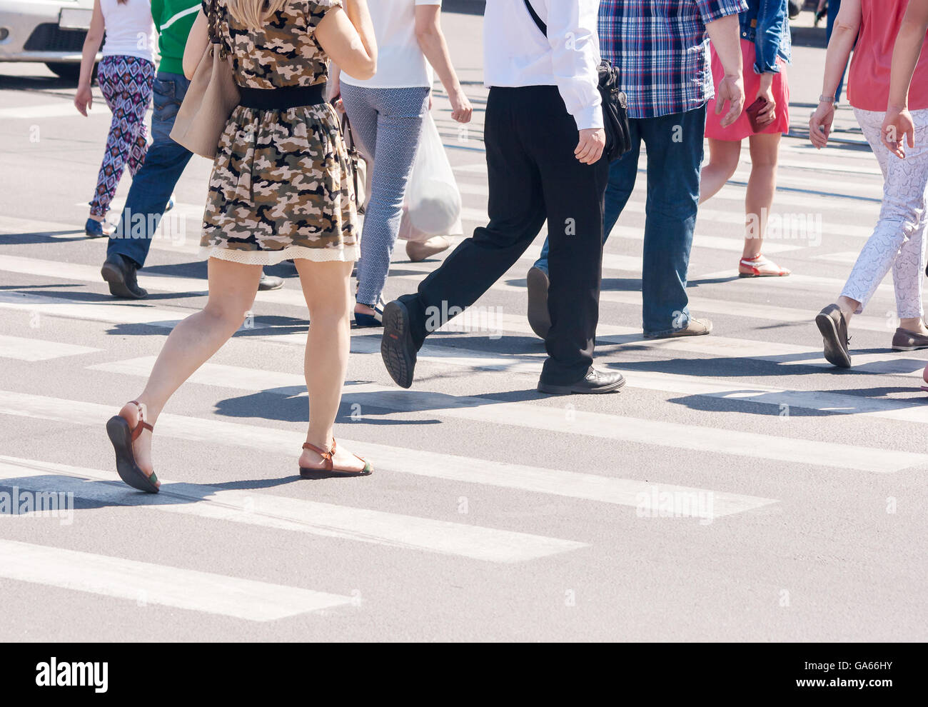legs of pedestrians crossing the road on summer day Stock Photo - Alamy