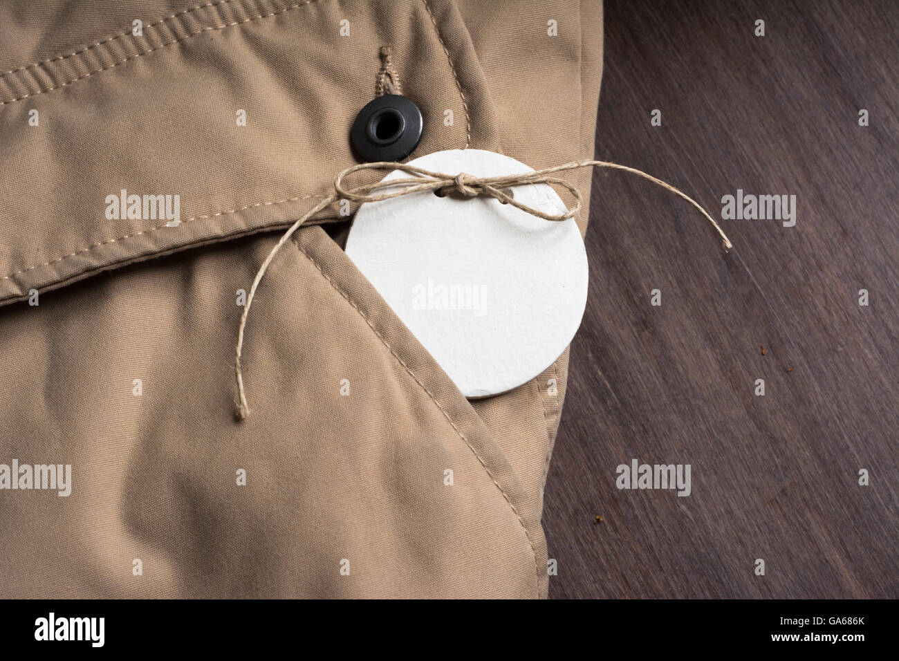 Price Tag, in the pocket of a jacket beige winter Stock Photo - Alamy