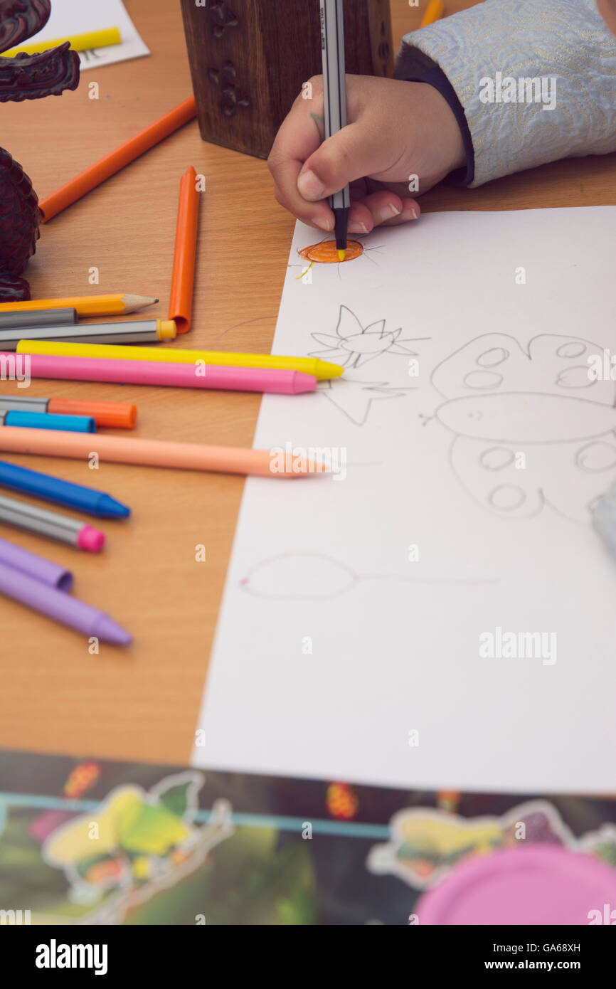 Child painting with crayons Stock Photo - Alamy