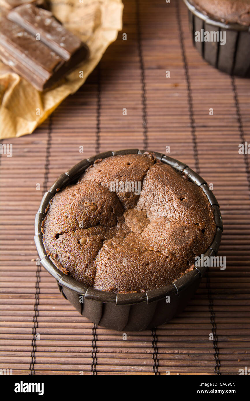 two coulant cakes on brown bamboo placemat Stock Photo - Alamy