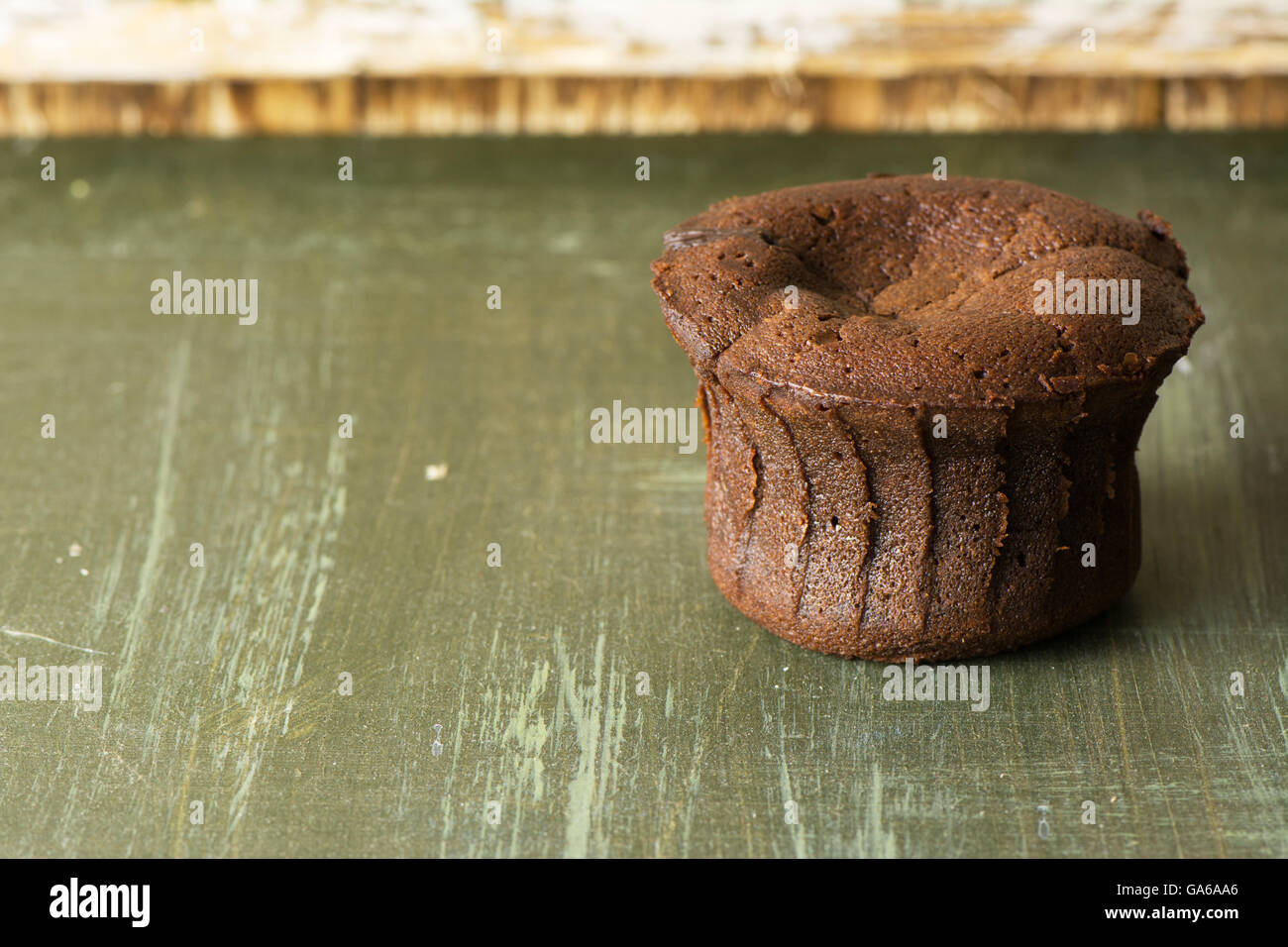 coulant chocolate cake, baked on blue wood in a rustic setting Stock ...