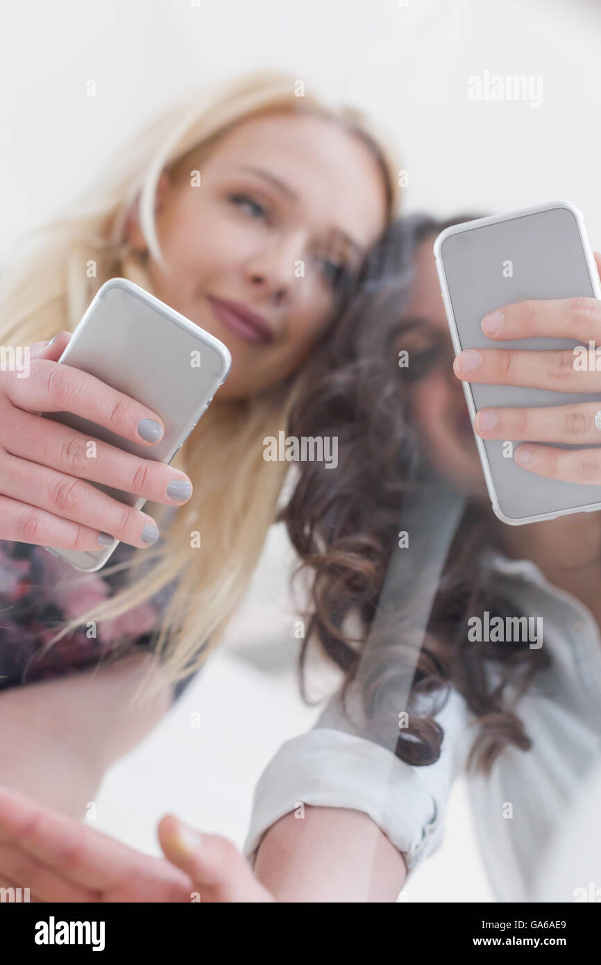 people communication and friendship concept - smiling young women ...