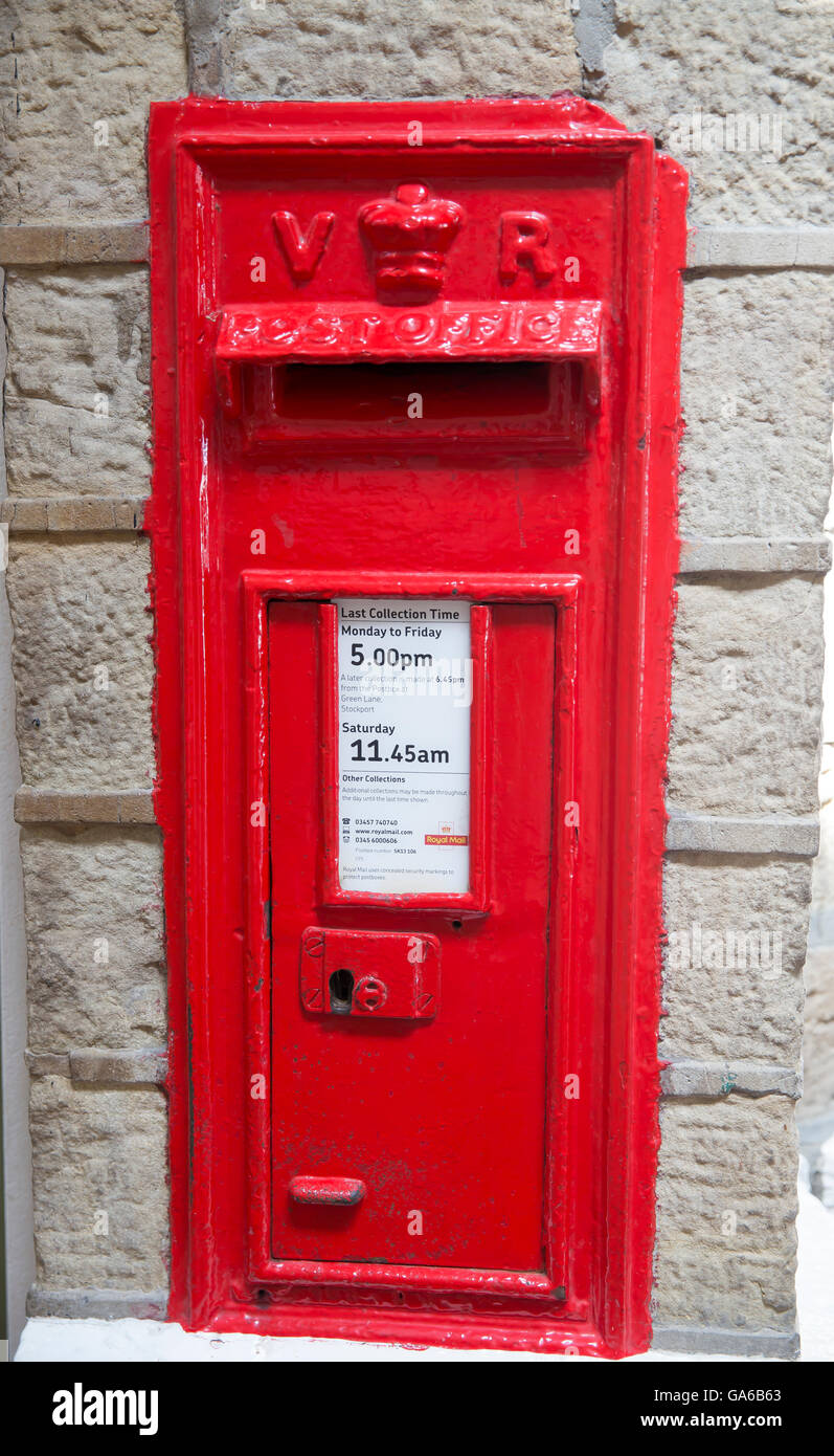 Old VR red letter box in a wall outside Glossop in Derbyshire Stock ...