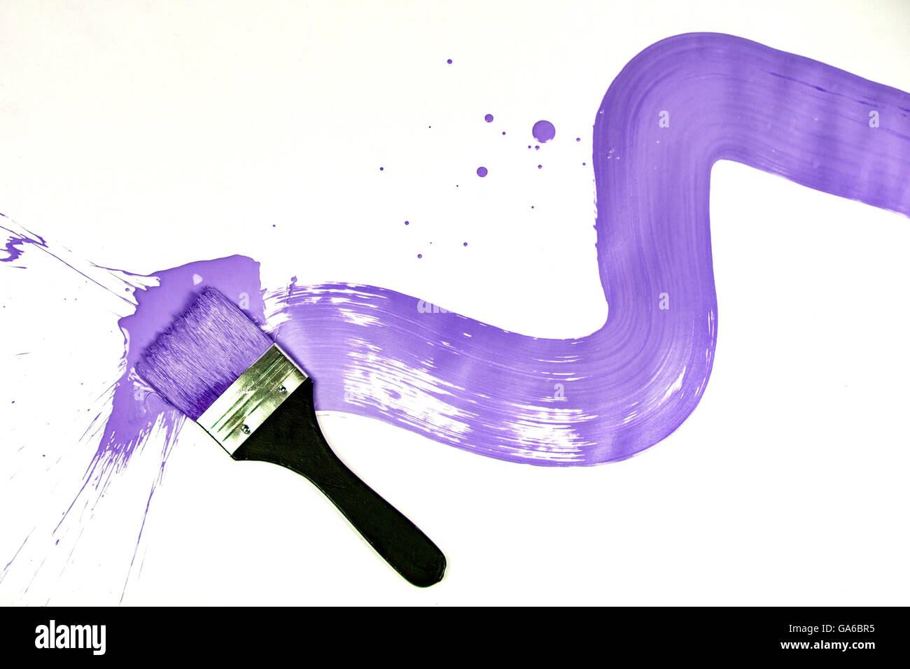 Paintbrush in purple paint, smeared across a white canvas Stock Photo ...