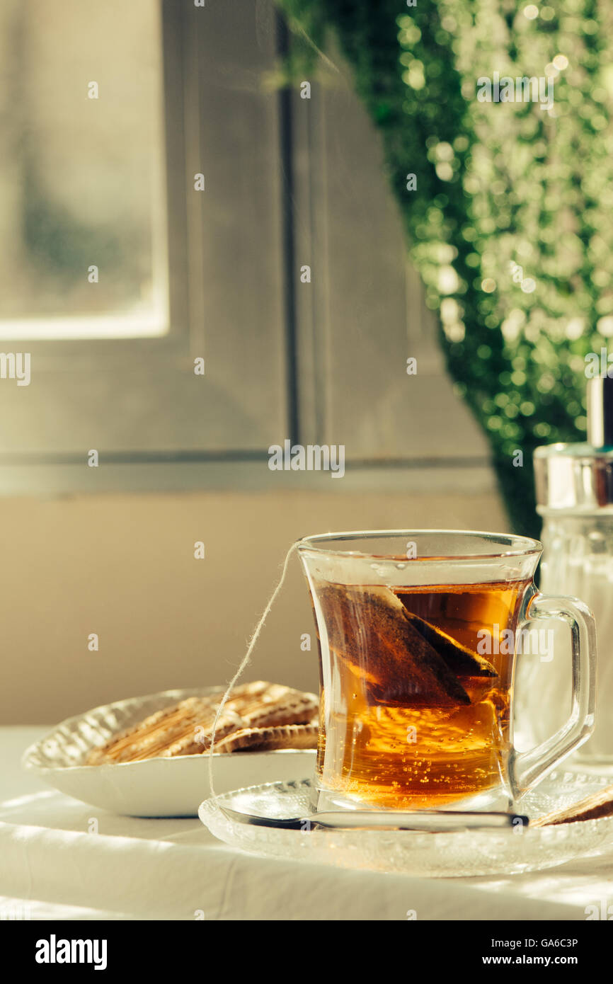 healthy cup of hot tea on breakfast table, with morning light Stock ...