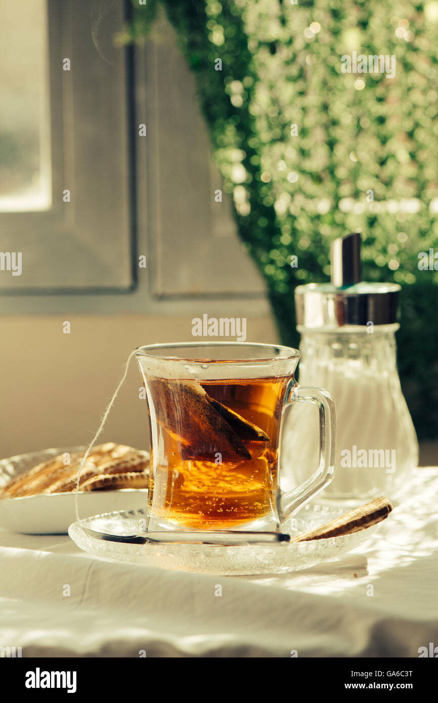 healthy cup of hot tea on breakfast table, with morning light Stock ...