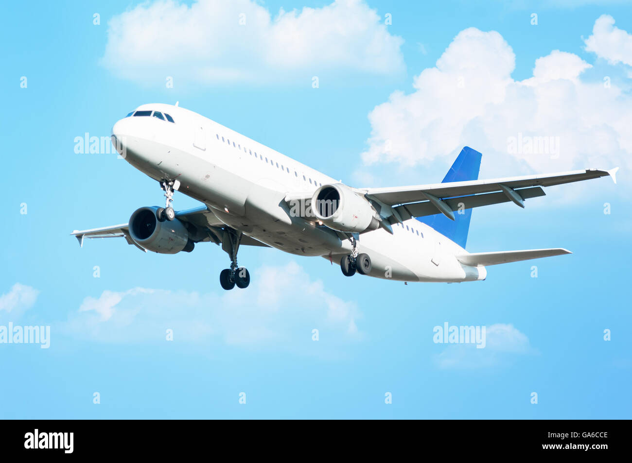 Airplane flying in the air Stock Photo - Alamy