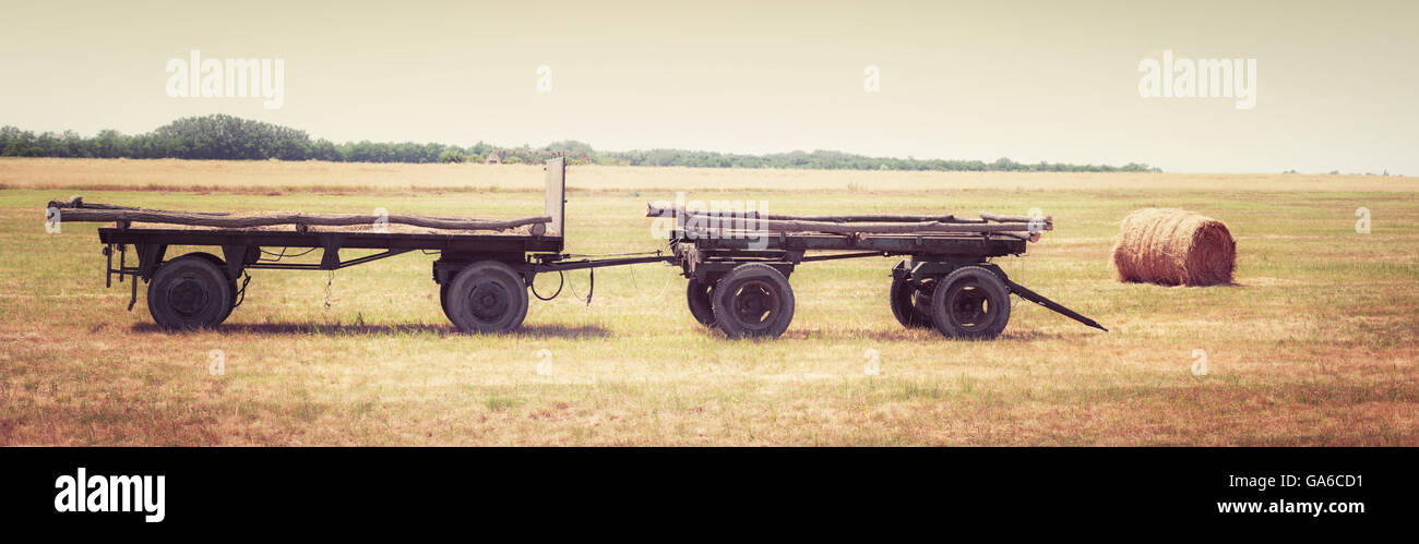 Farm wagon on the field Stock Photo - Alamy