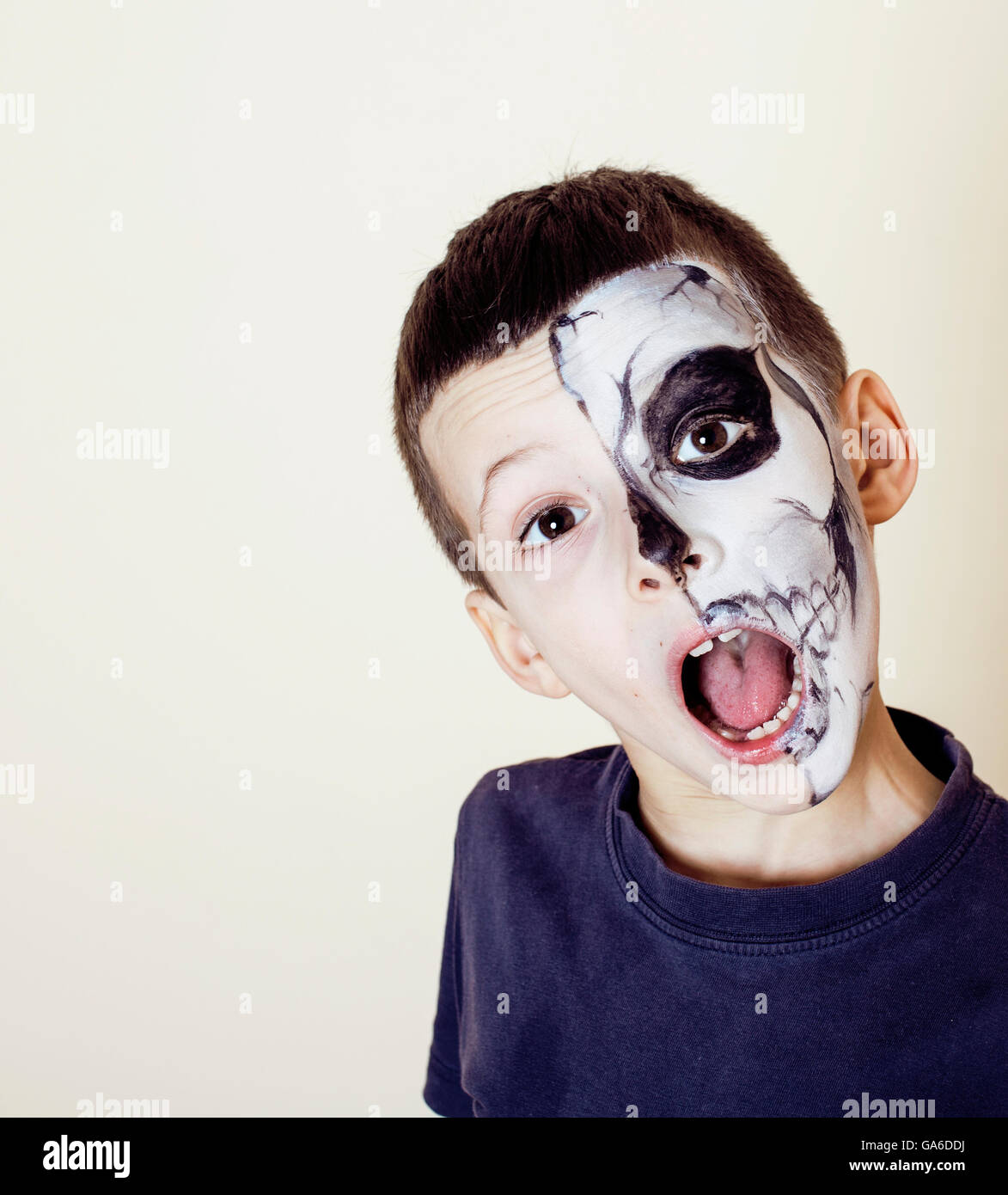 little cute boy with facepaint like skeleton to celebrate halloween ...