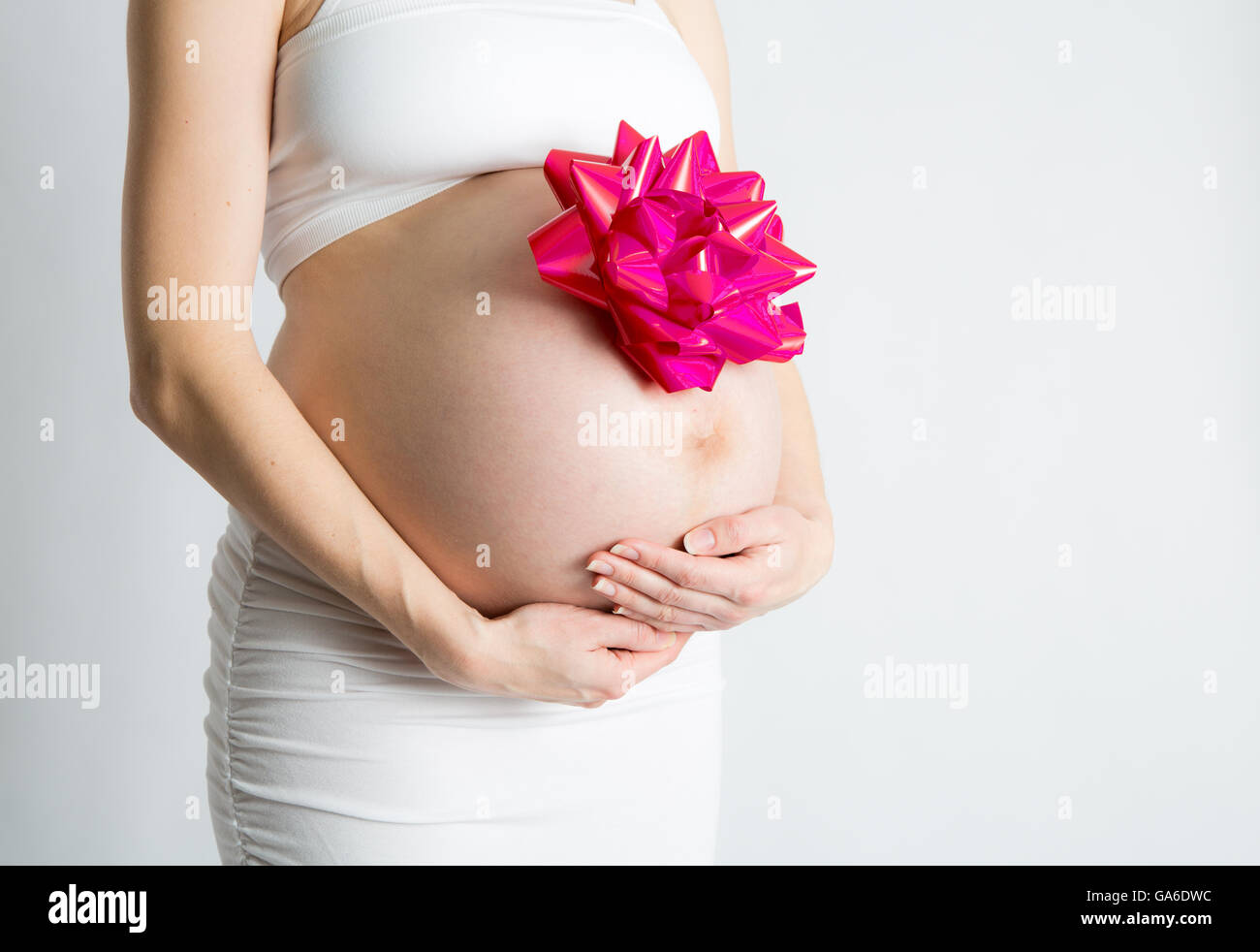 Pregnant belly and bow hi-res stock photography and images - Alamy