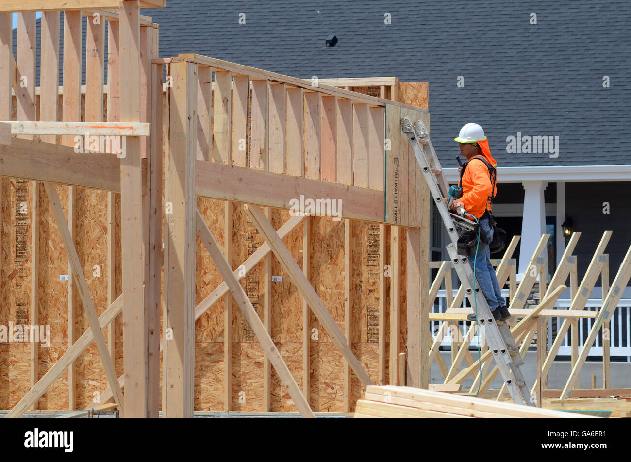 Carpenter works on framing in new subdivision in Superior Colorado ...