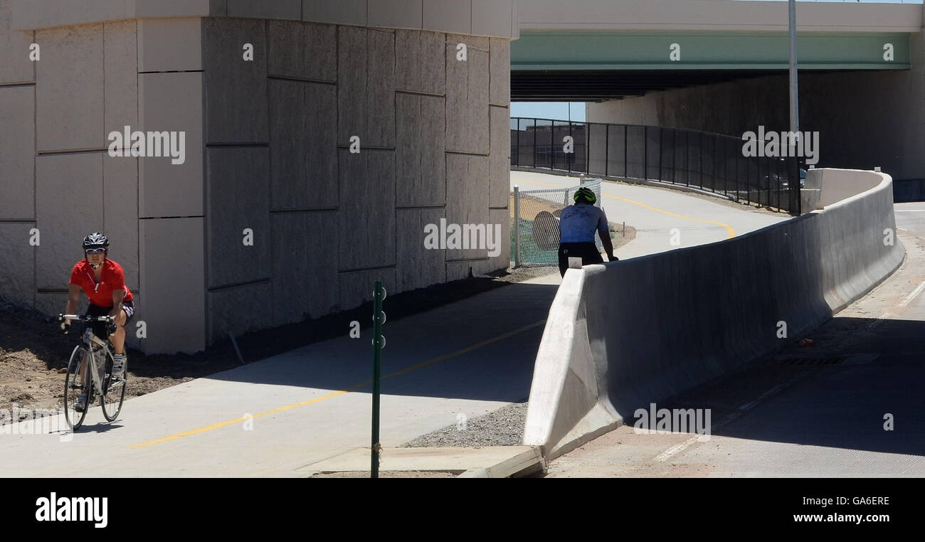 Bike riders on the U.S. 36 bikeway pass under a bridge at the U.S. 36 ...