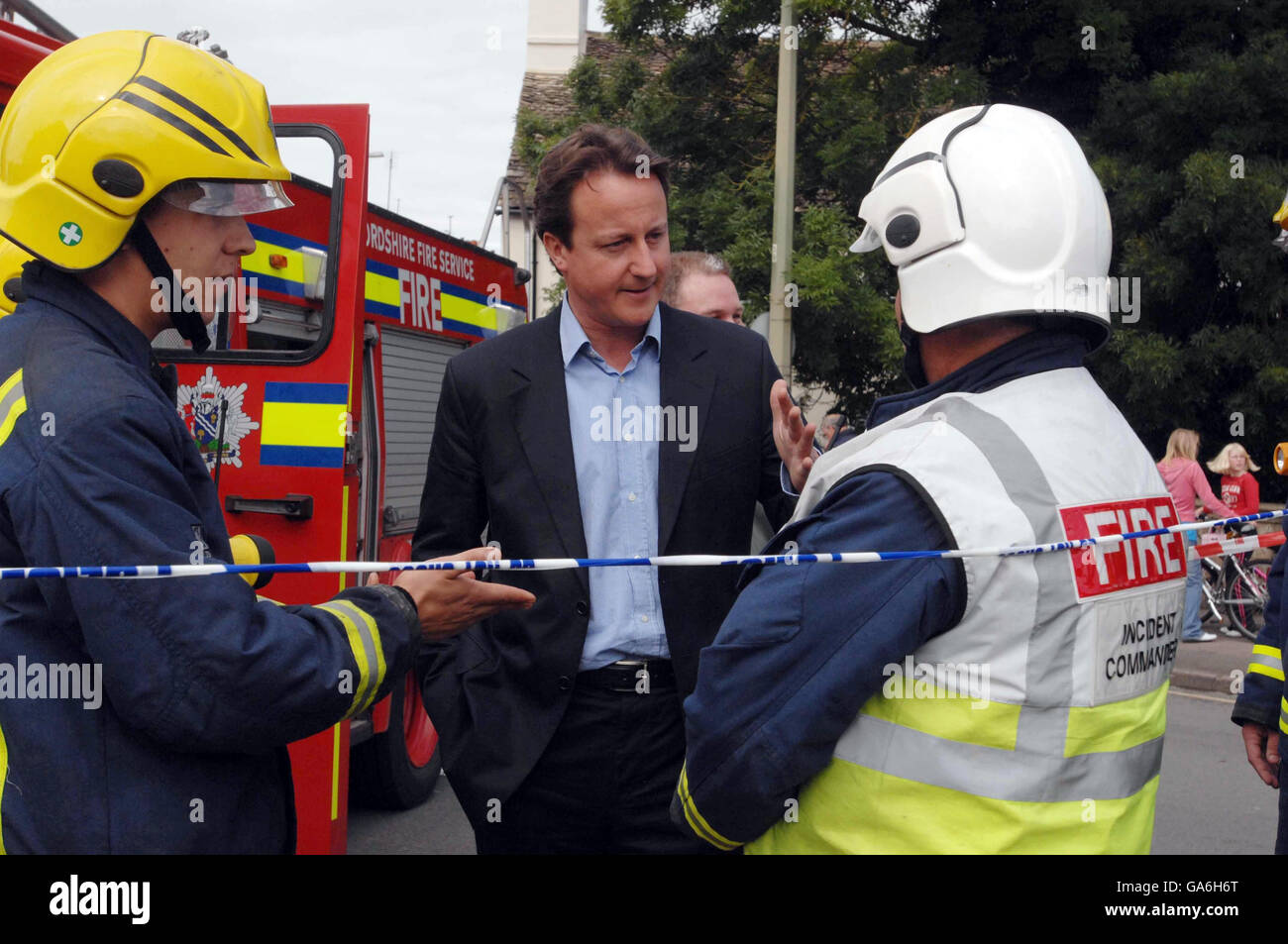 Tory Leader David Cameron speaks to the rescue services in the flooded ...