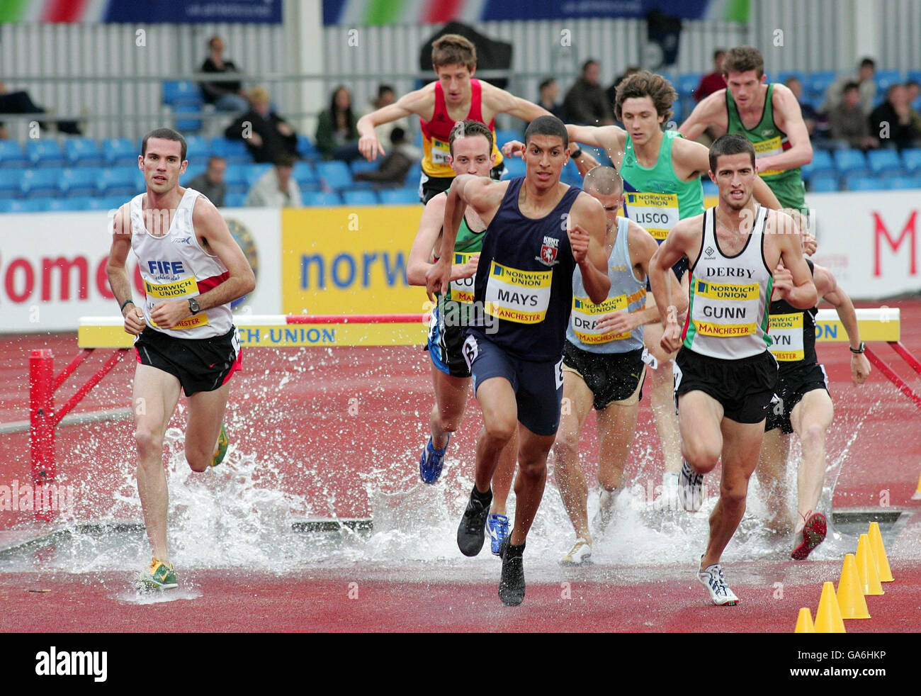 Andrew Lemoncello (left) goes on to win the Mens' 3000m Steeplechase ...