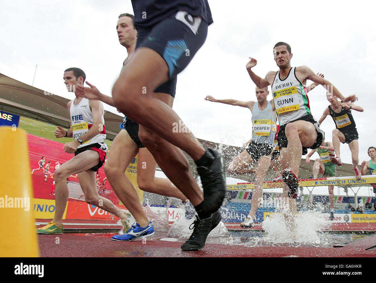Andrew Lemoncello (left) goes on to win the Mens' 3000m Steeplechase ...
