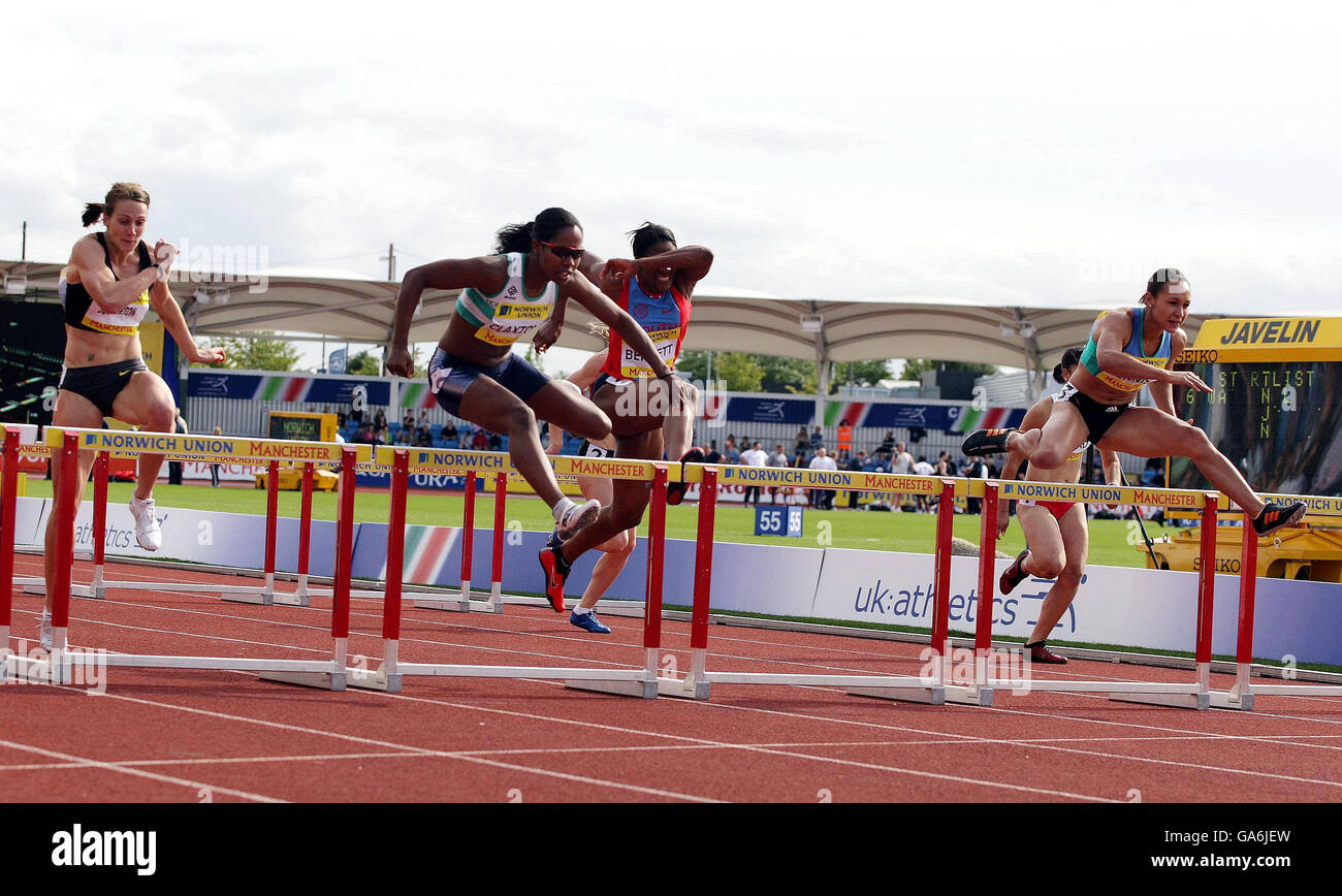 Jessica Ennis (right) clears the last hurdle to win the Women's 100 ...