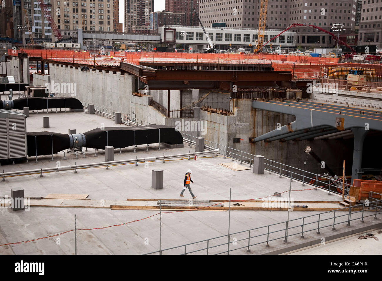 A worker walks across the construction site at Ground Zero, in New York ...