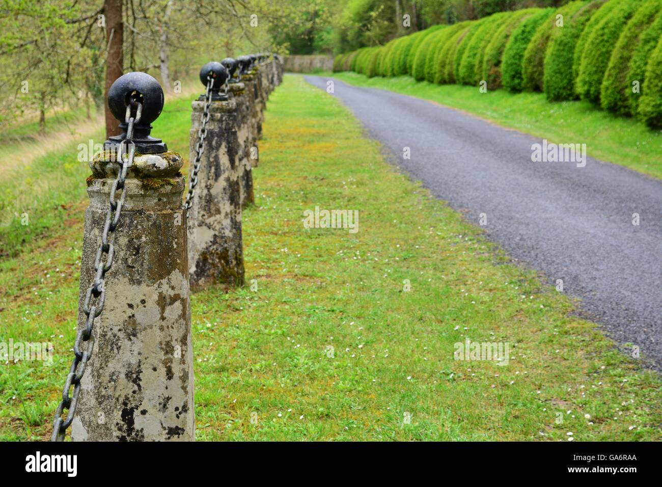 old stone posts with chain link fence Stock Photo - Alamy