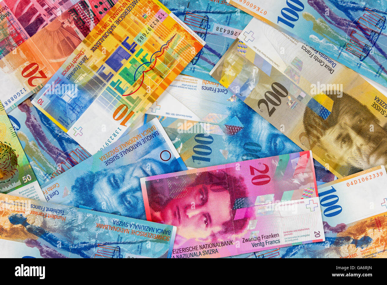 Business background made of swiss franc banknotes Stock Photo - Alamy