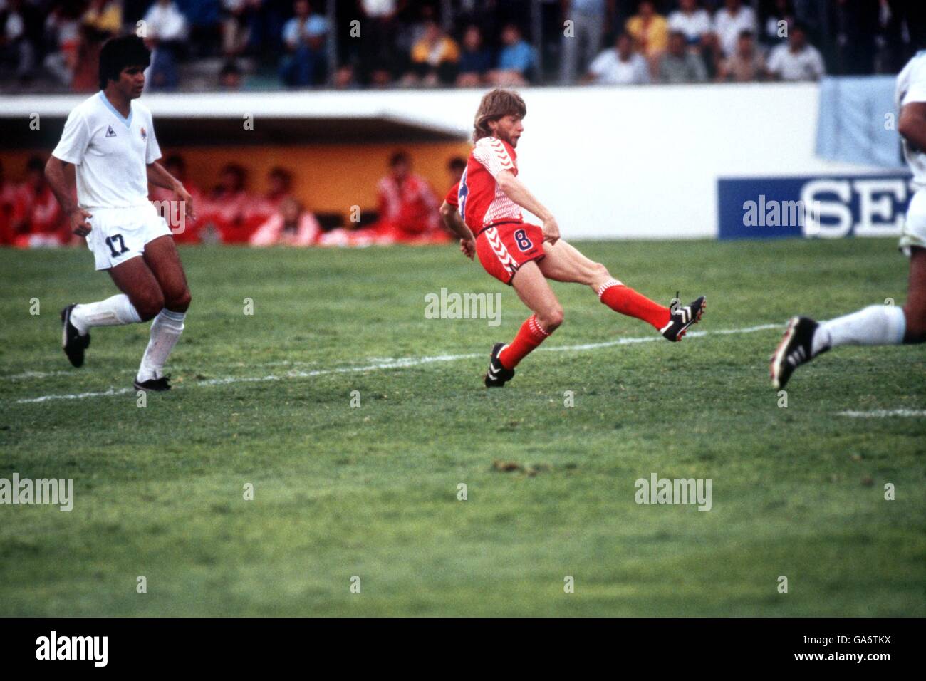 Denmarks jesper olsen scores against uruguay hi-res stock photography ...