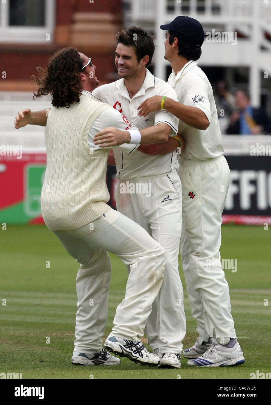 England's James Anderson (centre) celebrates the wicket of India's ...
