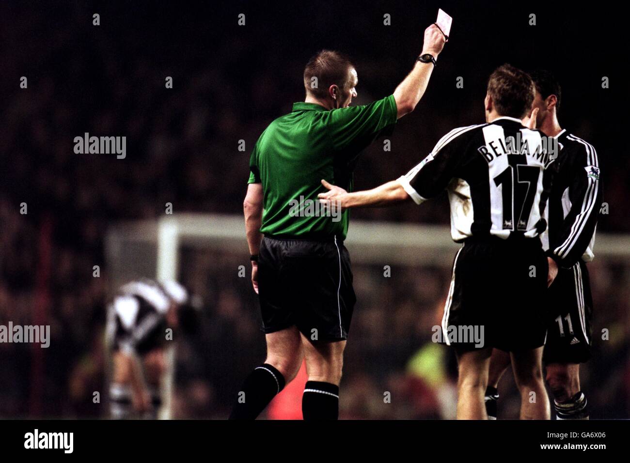 Newcastle United's Craig Bellamy is shown the red card by referee ...