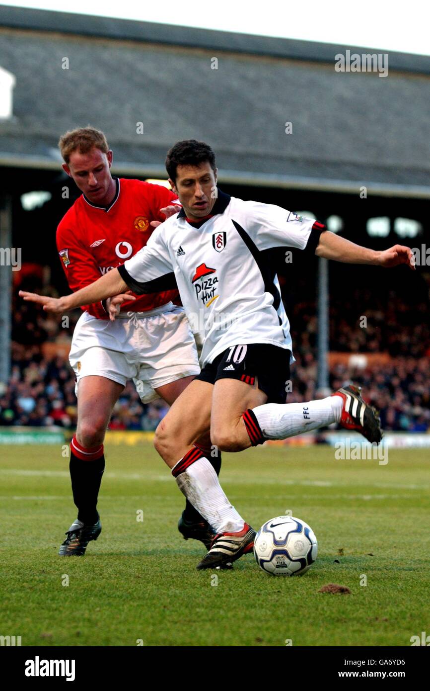 Fulham's John Collins and Manchester United's Nicky Butt battle for the ...