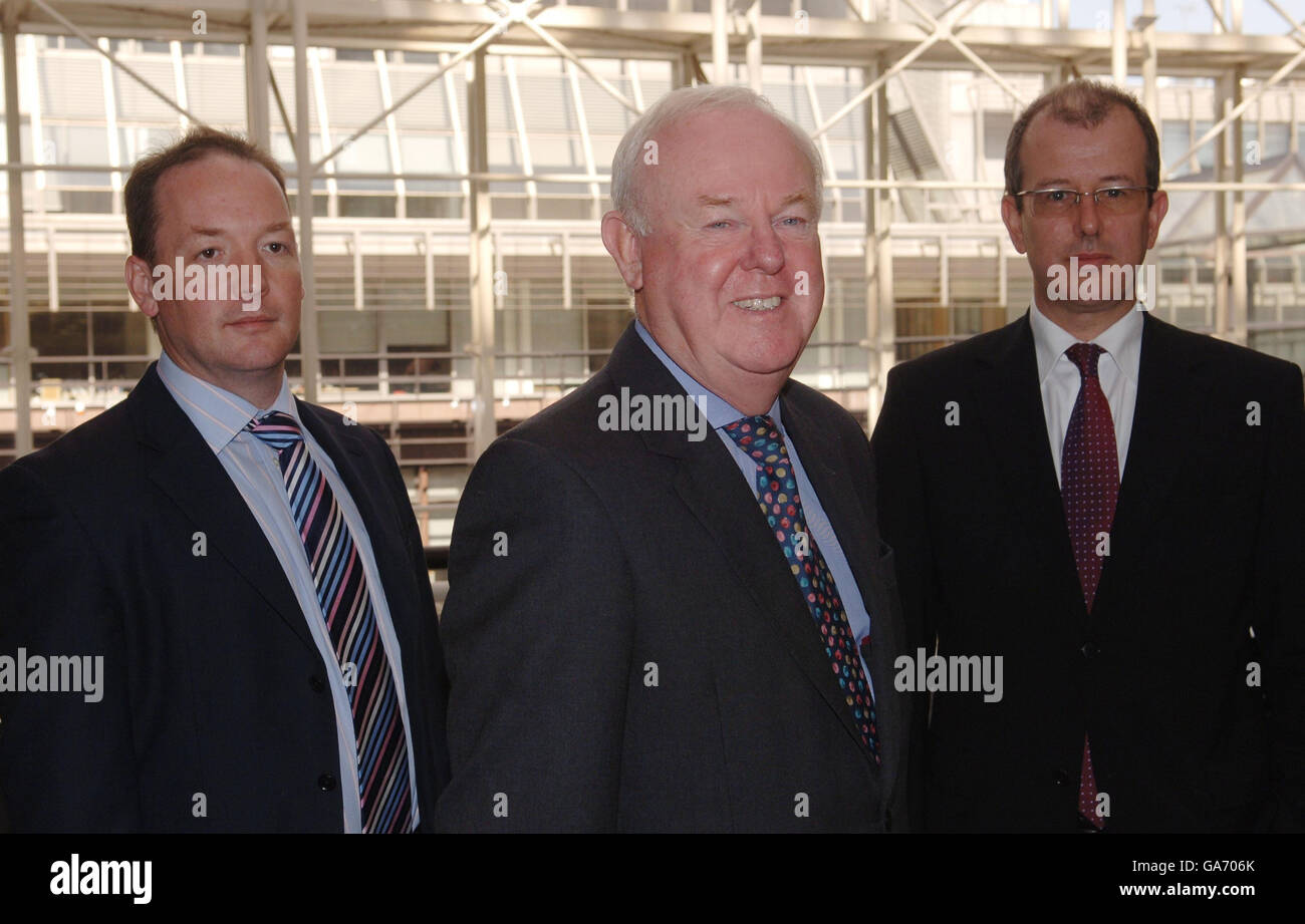 Chairman of newly merged Taylor Wimpey plc Norman Askew (centre) with ...