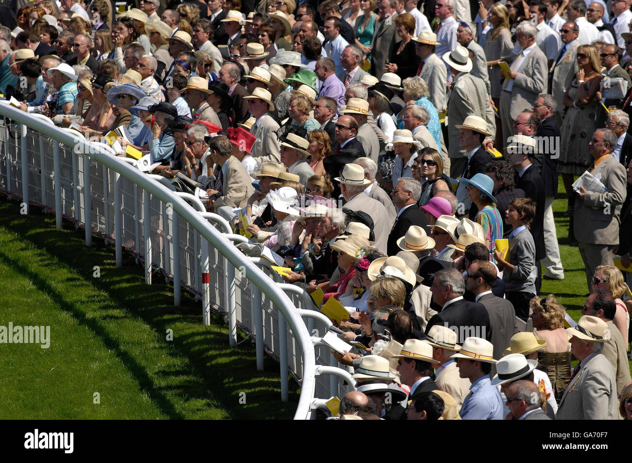 Spectators at the finish watch the first race at Goodwood Racecourse ...
