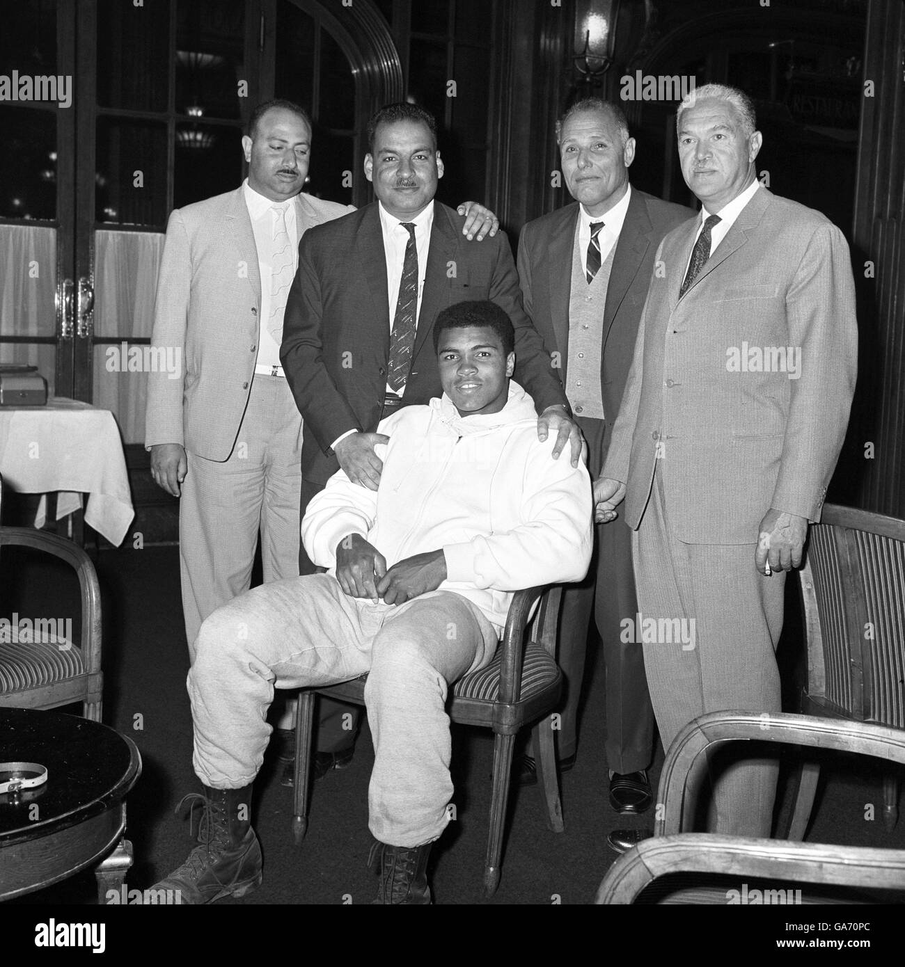 World Heavyweight Champion Muhammad Ali looks relaxed after finishing a ...
