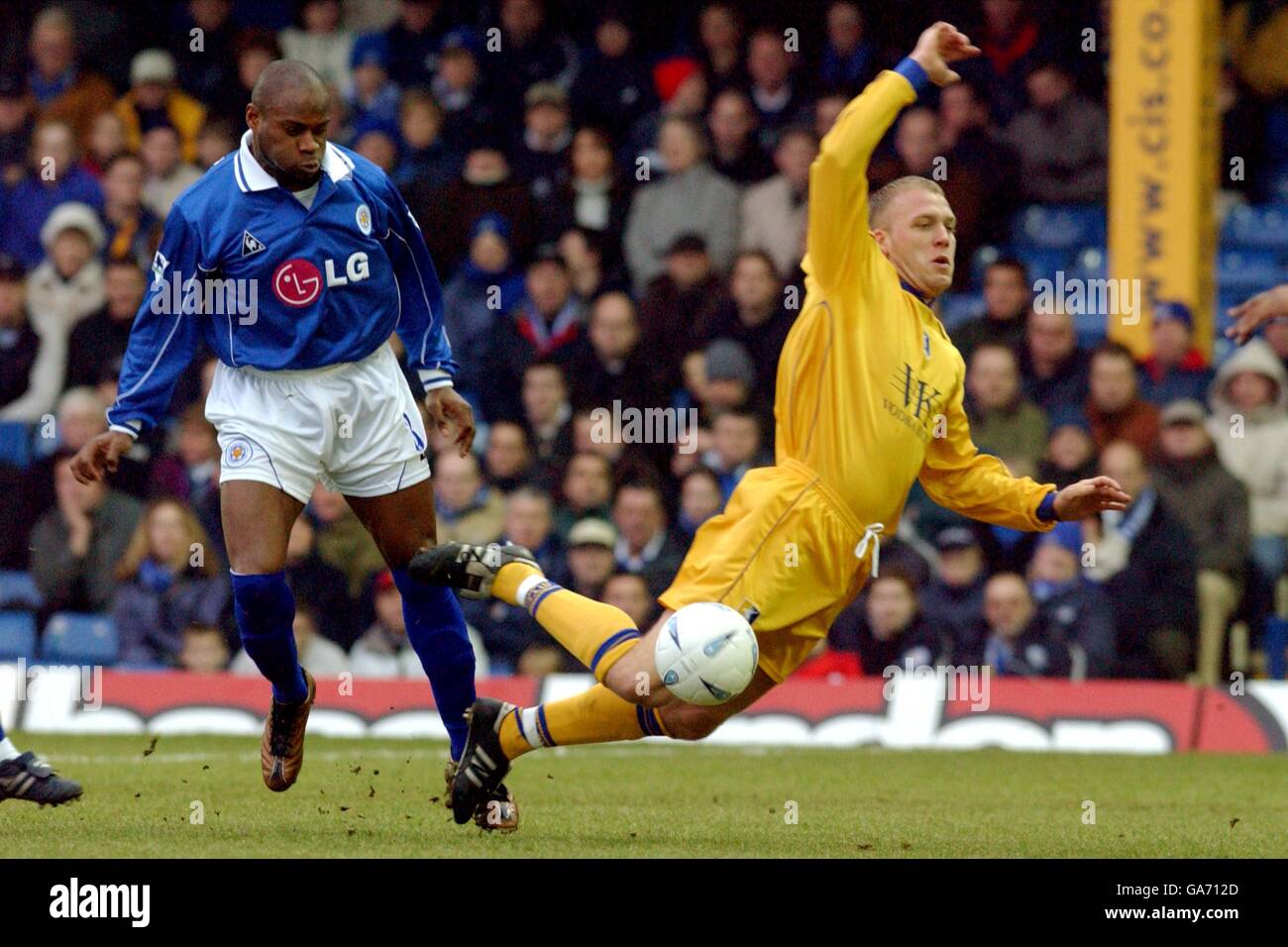 Leicester City 's Brian Deane tackles Mansfield Town's Bobby Hassell ...