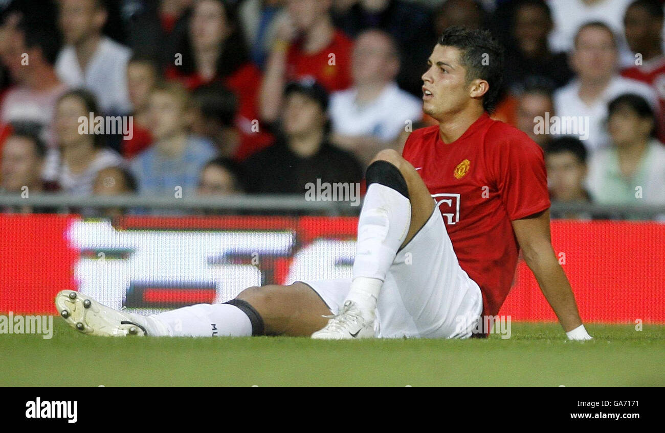 Manchester United's Cristiano Ronaldo sits on the ground after a ...